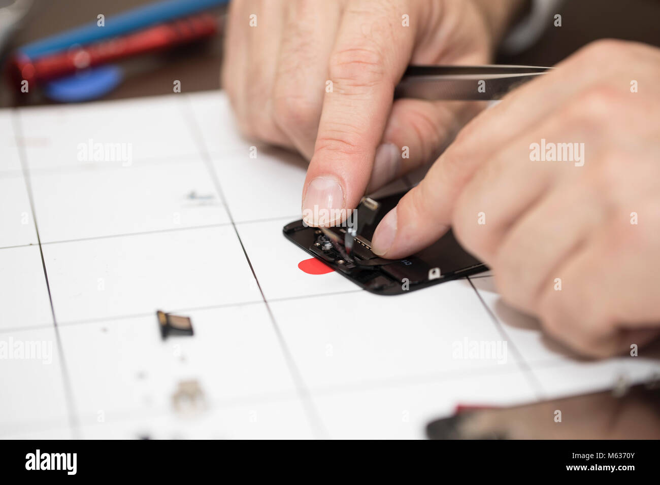 Process of replacing damaged screen glass at smartphone. Closeup Stock ...