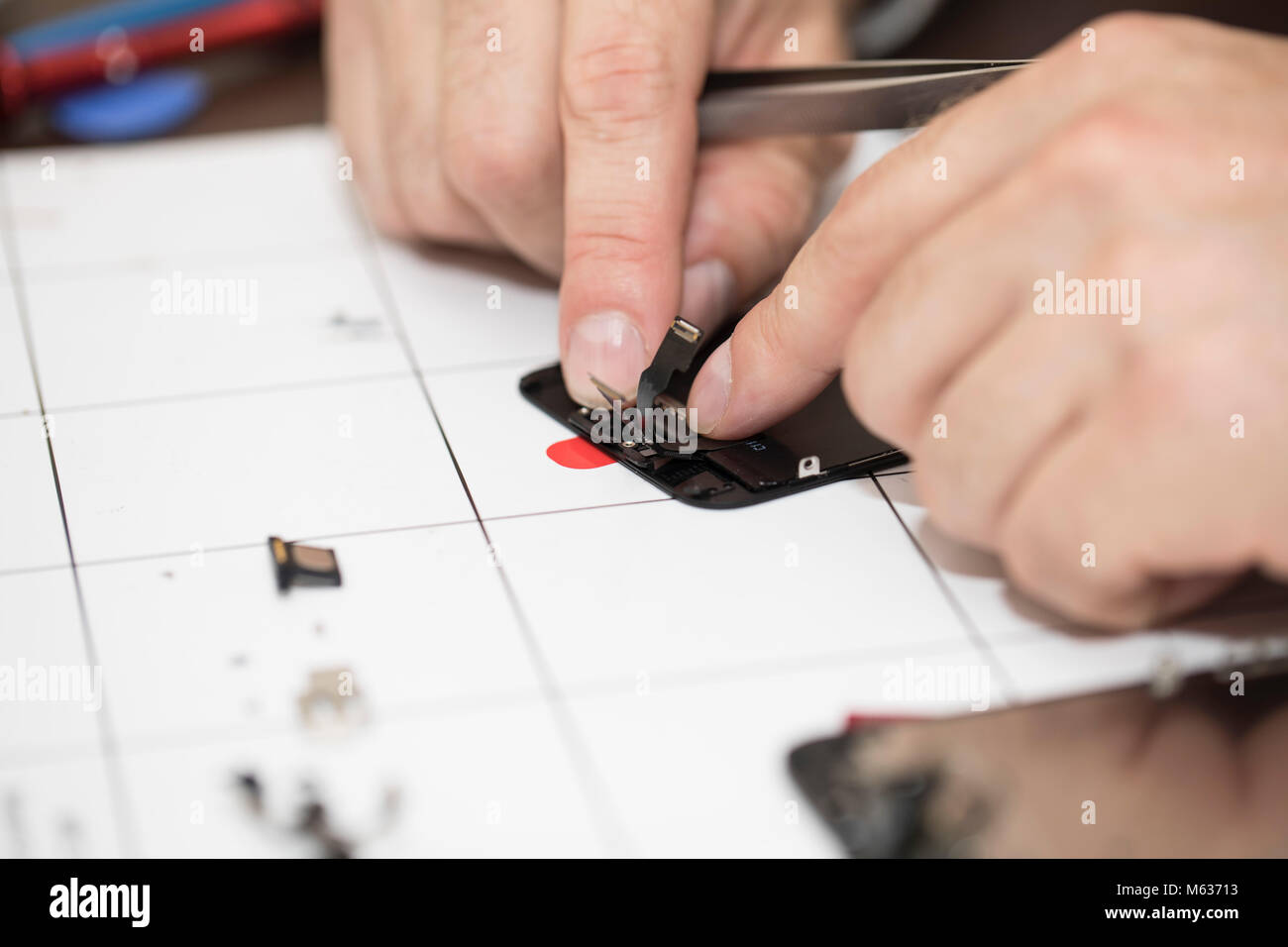 Process of replacing damaged screen glass at smartphone. Closeup Stock ...