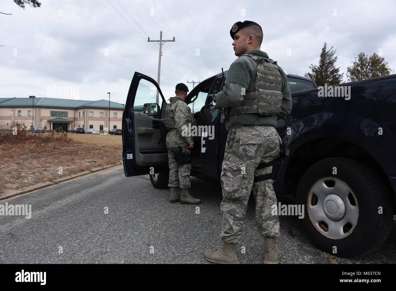 Members assigned to the 102nd Security Forces Squadron participate in ...