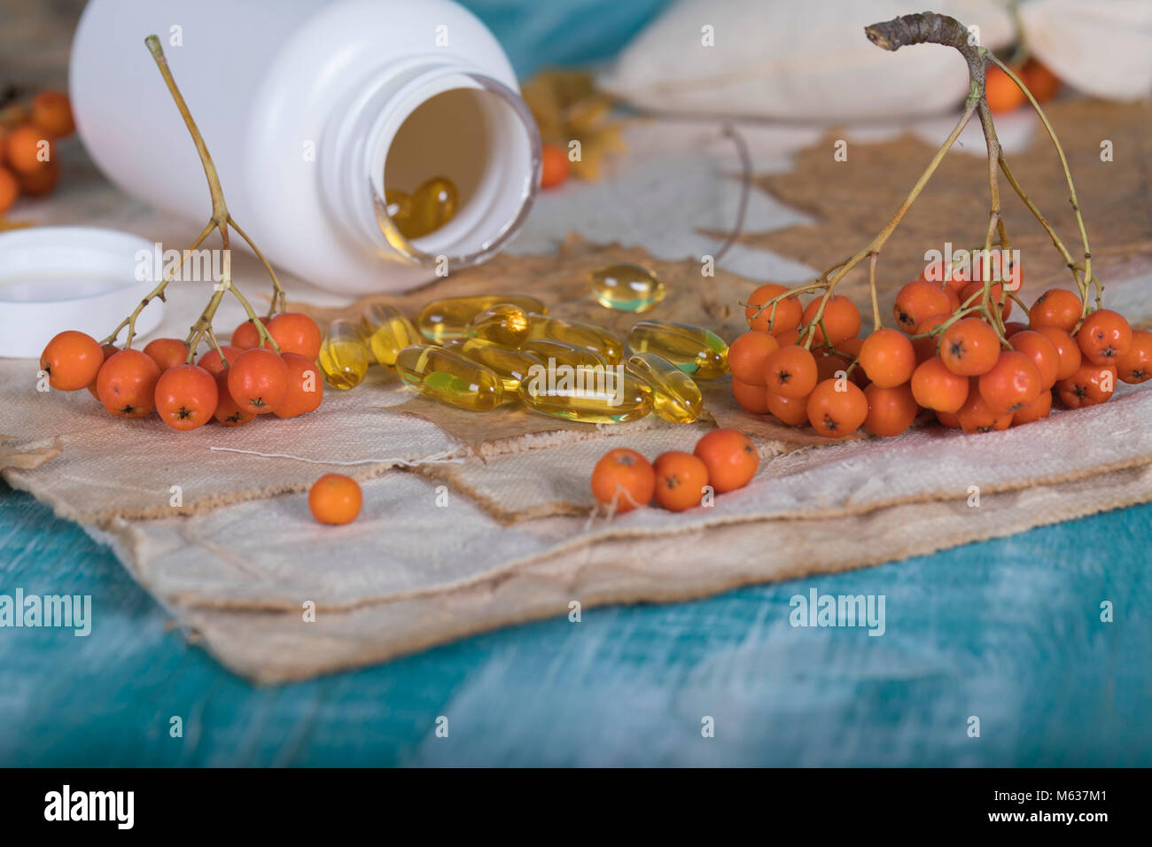 Softgels with rowan berries oil. Closeup Stock Photo - Alamy