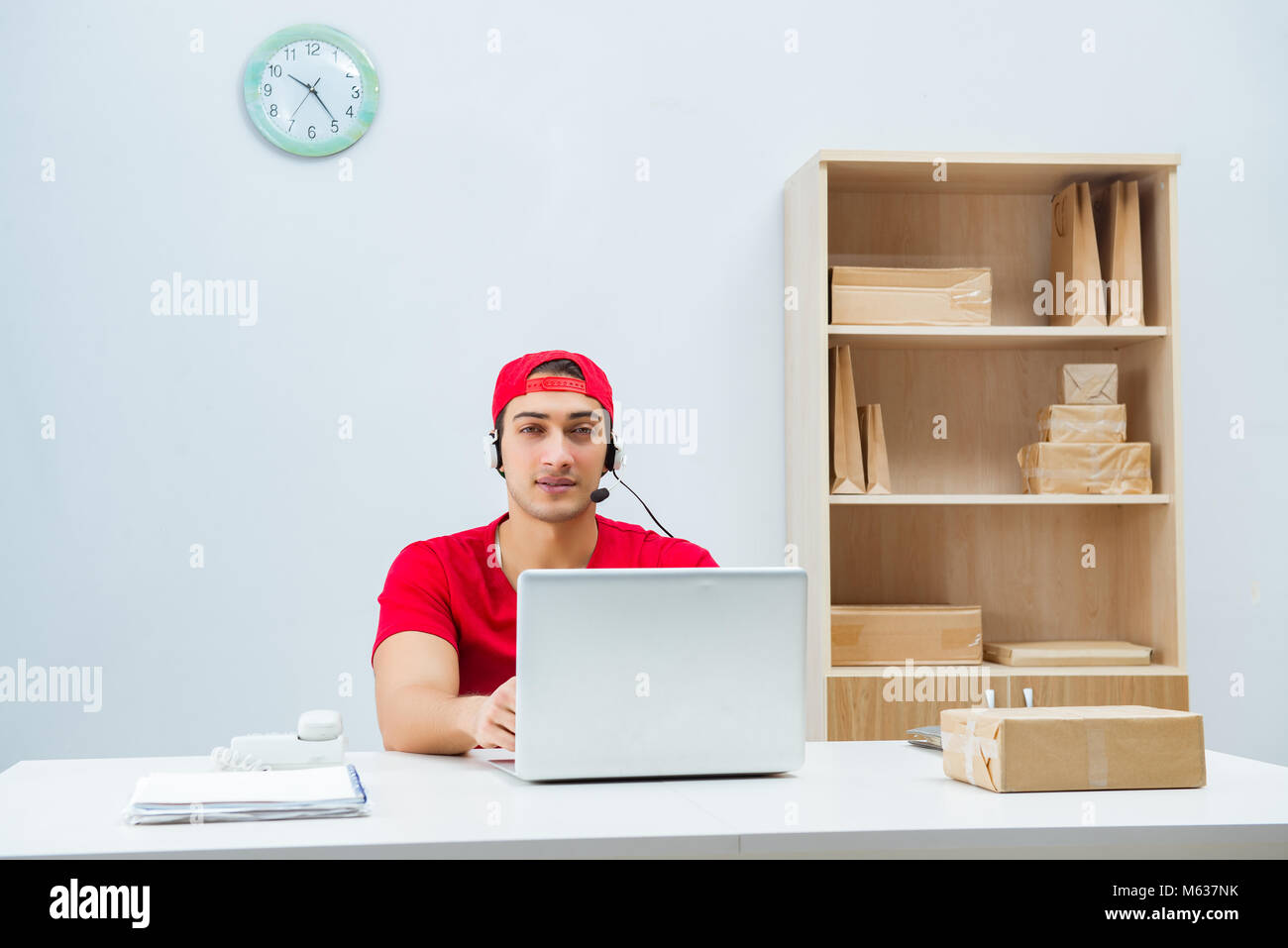 Call center worker at parcel distribution center in post office Stock ...