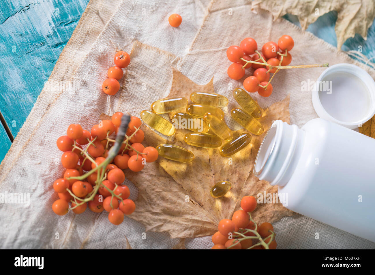 Softgels with rowan berries oil. Closeup Stock Photo - Alamy