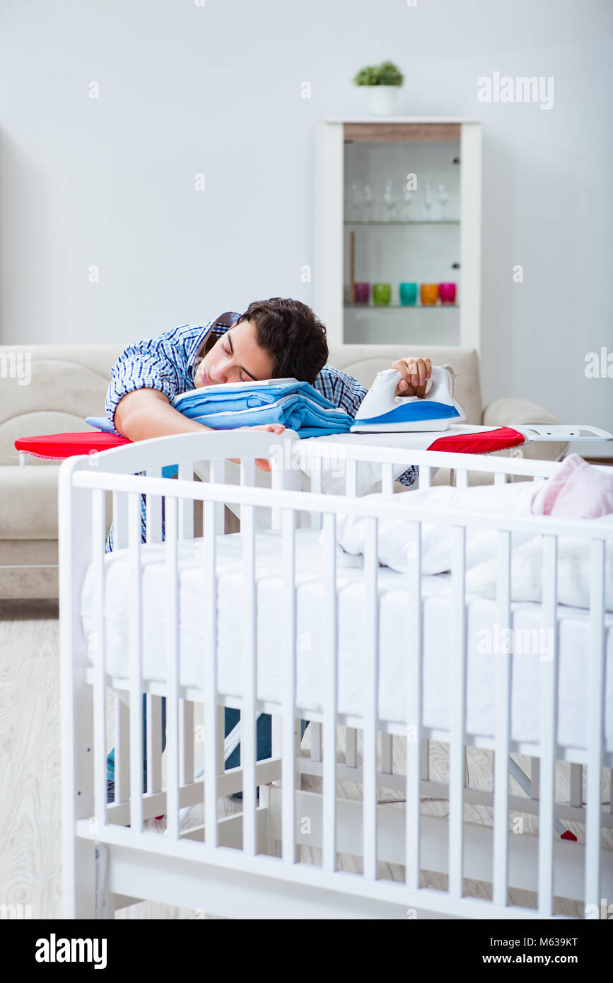 Young dad looking after newborn baby Stock Photo - Alamy
