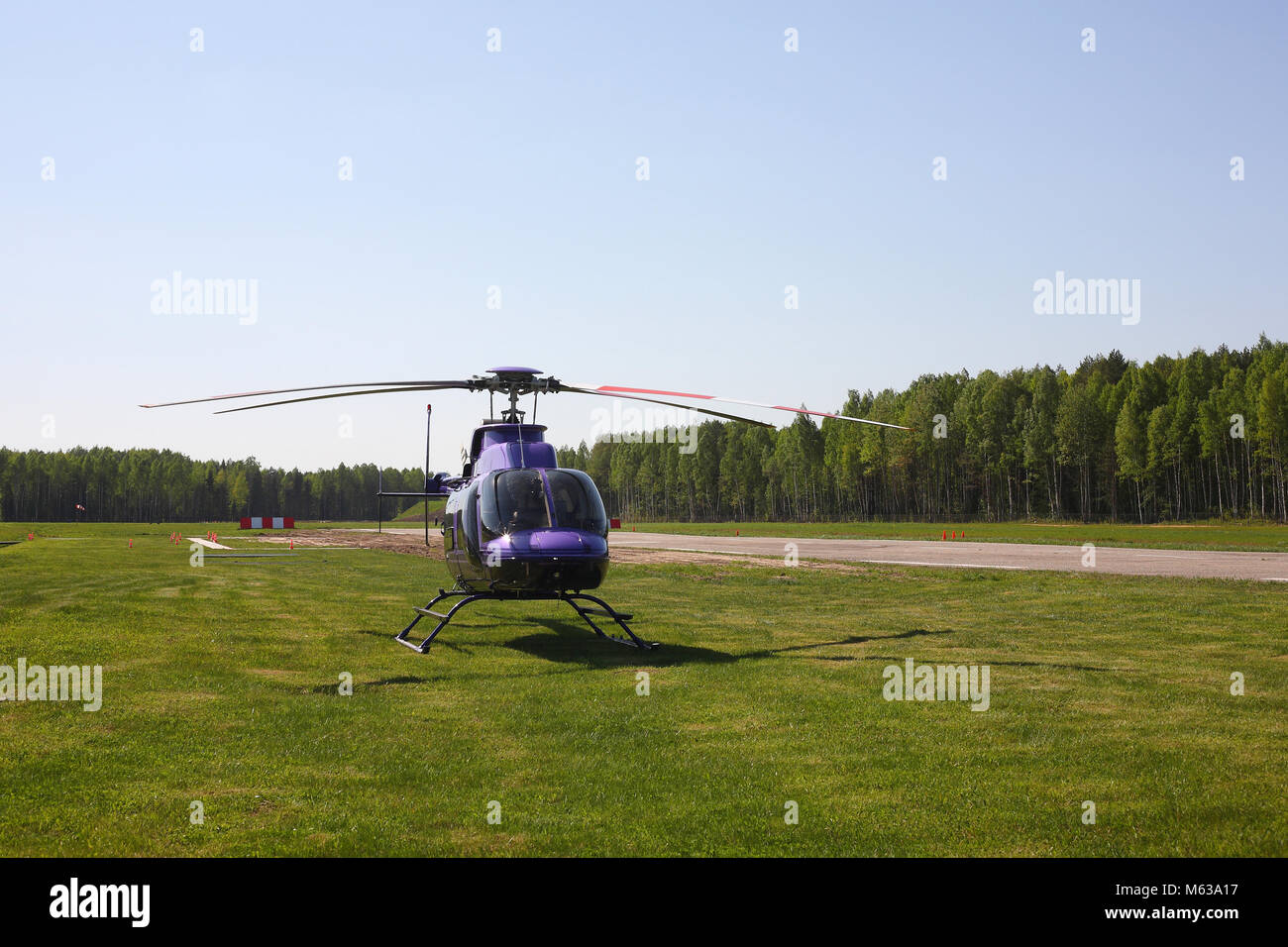 Aircraft purple helicopter on parking hi-res stock photography and ...