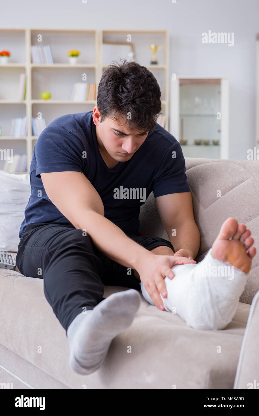 Man with broken leg recovering at home Stock Photo - Alamy