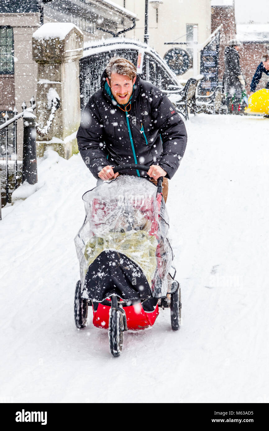 A local man pushing a pushchair down a slope, Lewes, Sussex, UK Stock ...