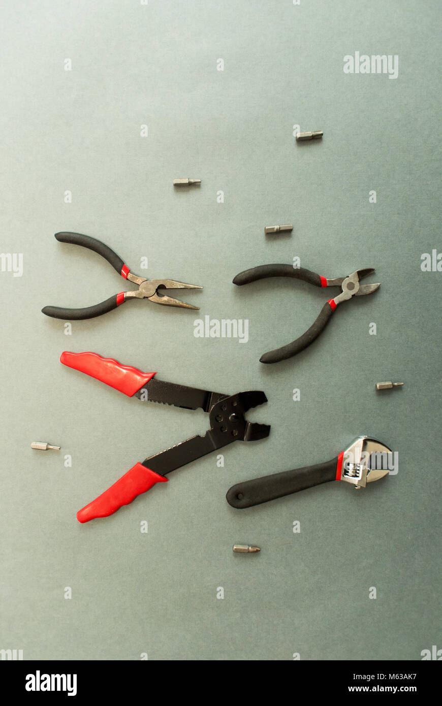 Set of tools on grey background. Looks like a fishes Stock Photo - Alamy