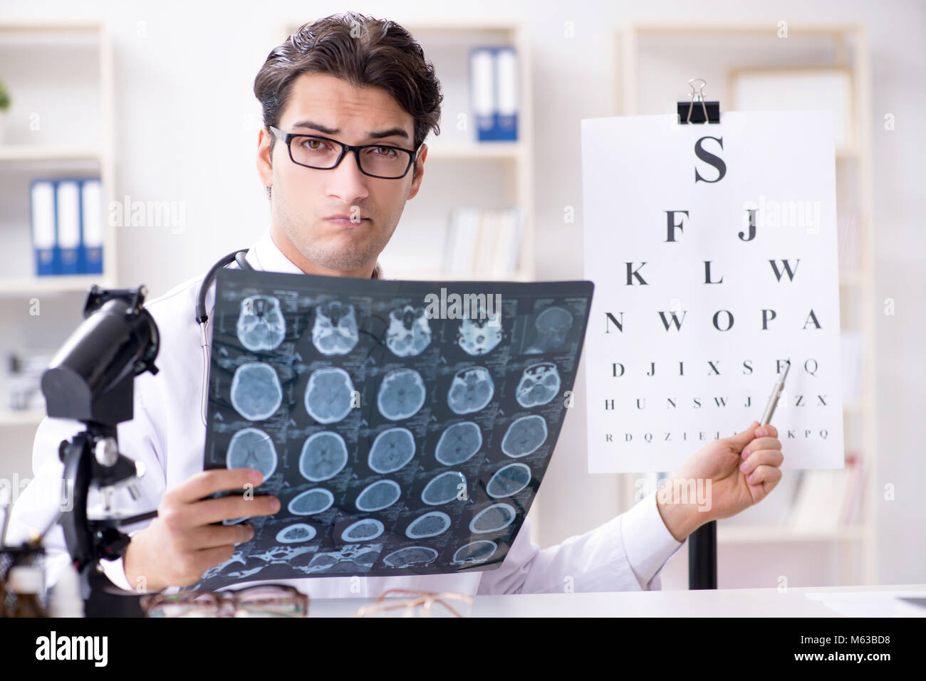 Eye doctor in medical concept Stock Photo - Alamy