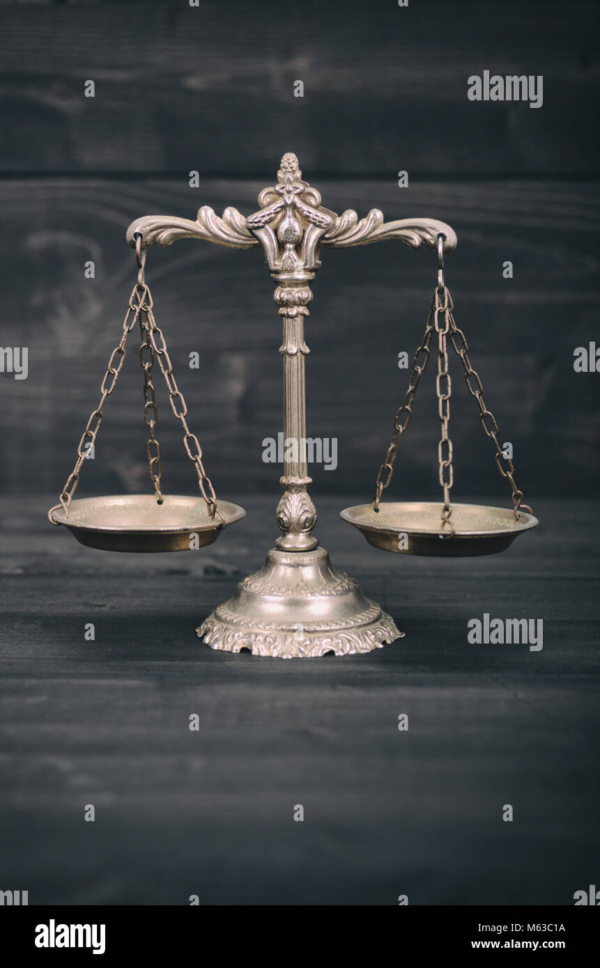 Law and Justice, Legality concept, Scales of Justice on a black wooden ...