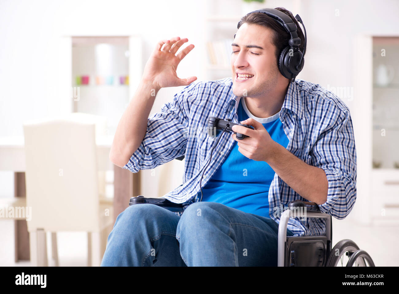 Disabled man playing computer games during rehabilitation Stock Photo ...