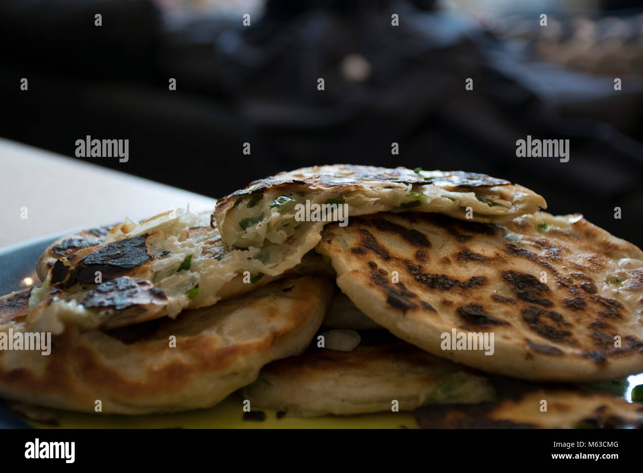 Homemade Chinese spring onion pancakes for cooking demonstration Stock ...