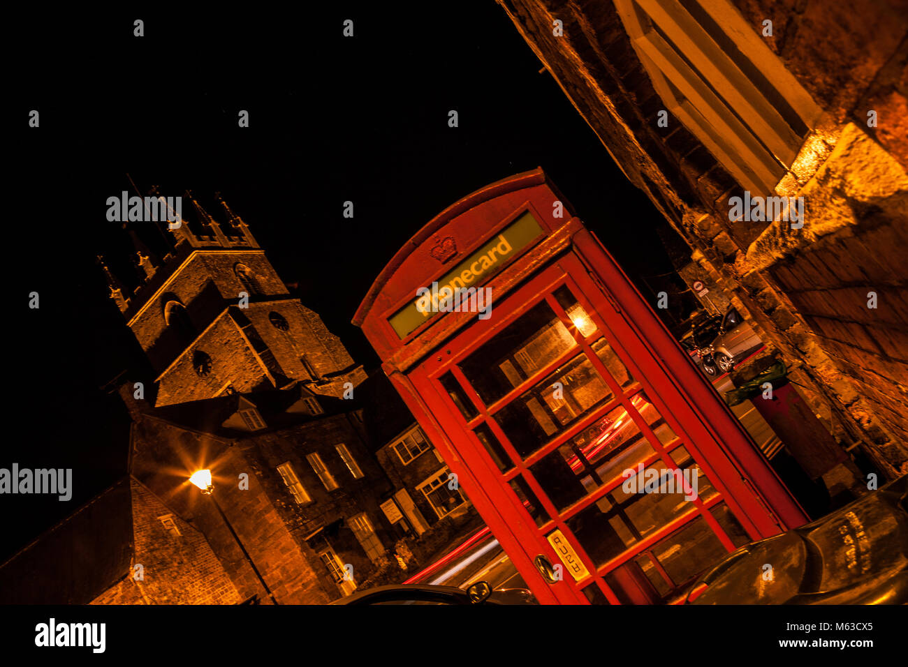 Red BT Phone Box in Deddington village market square at night Stock ...