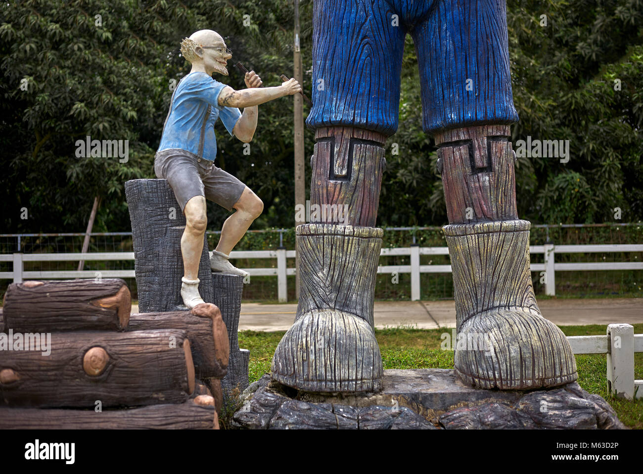 Geppetto carving Pinocchio. Stone statue of the famous Children's story ...
