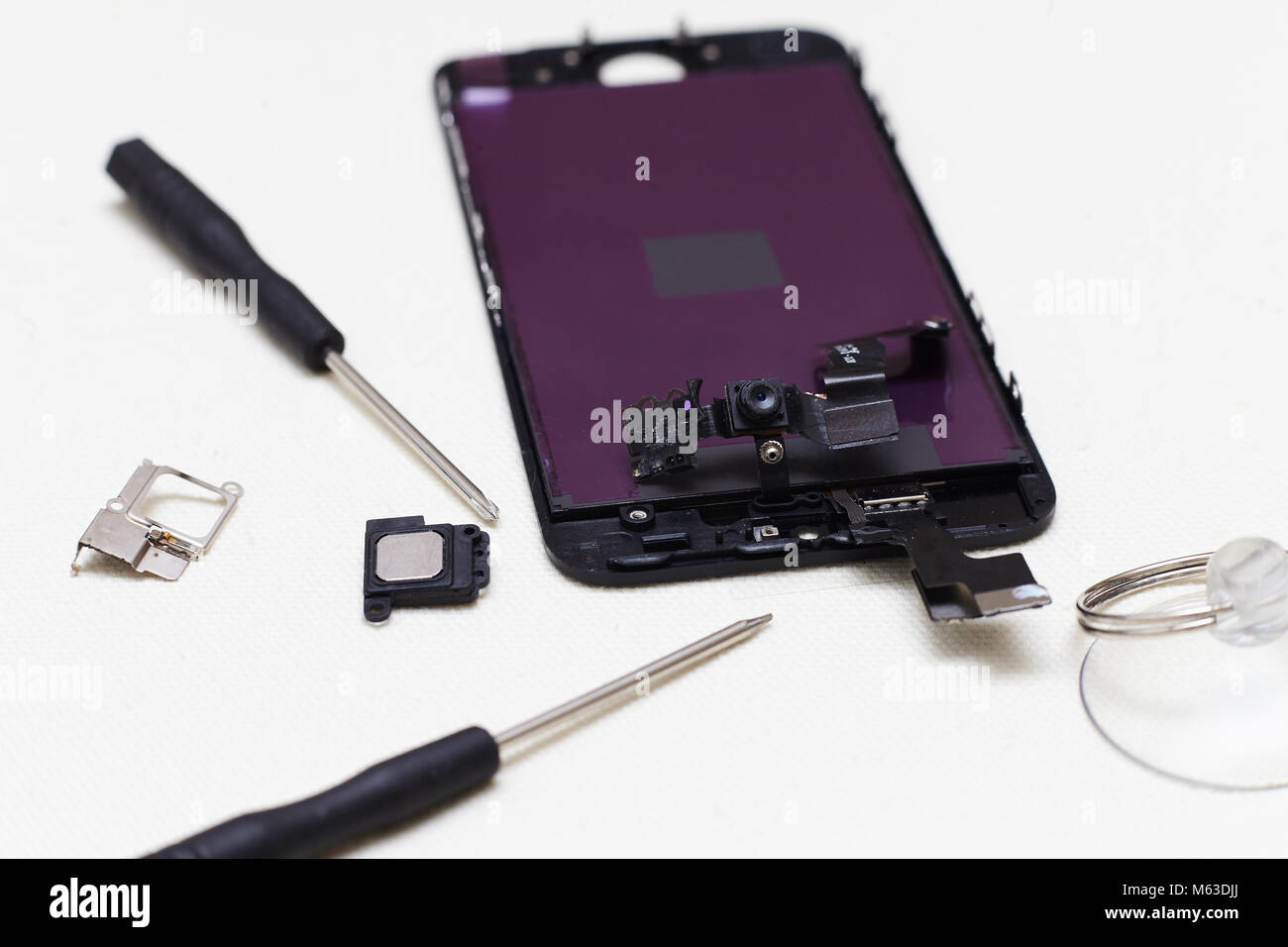 Close-up photos showing process of mobile phone repair, changing the ...