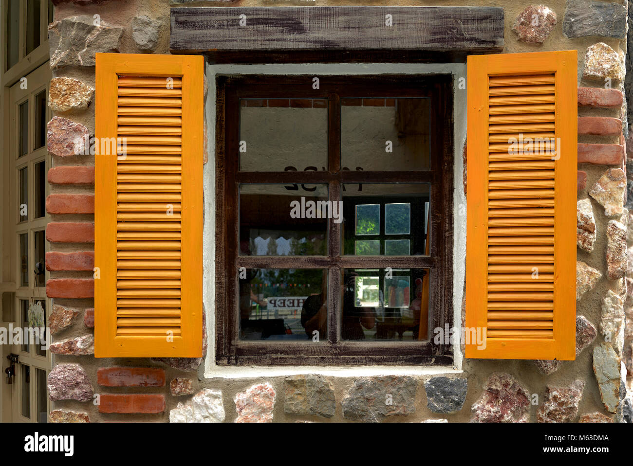 Shuttered window of a stone built cottage. Wooden shutters Stock Photo ...