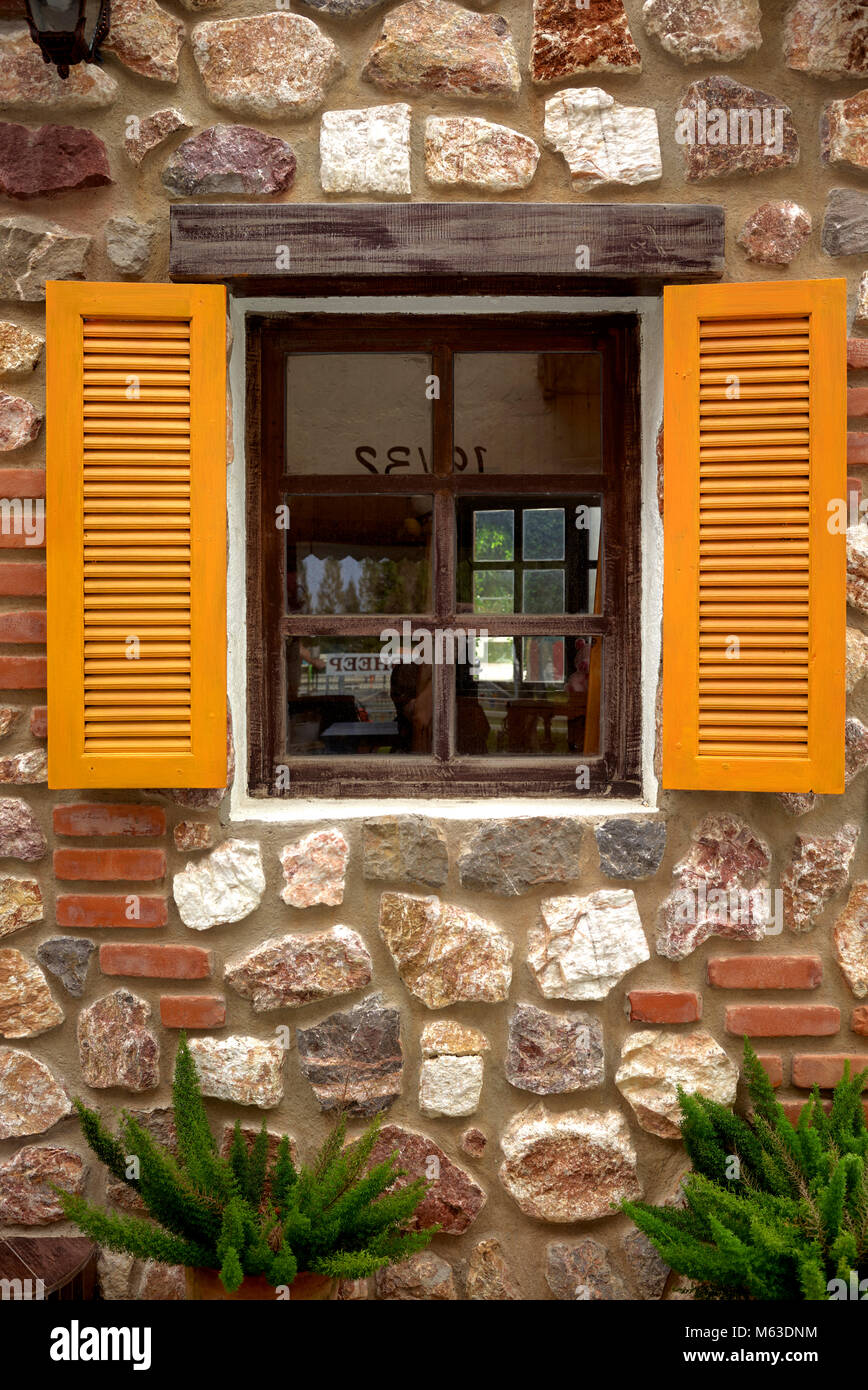Shuttered window of a stone built cottage. Wooden shutters Stock Photo ...