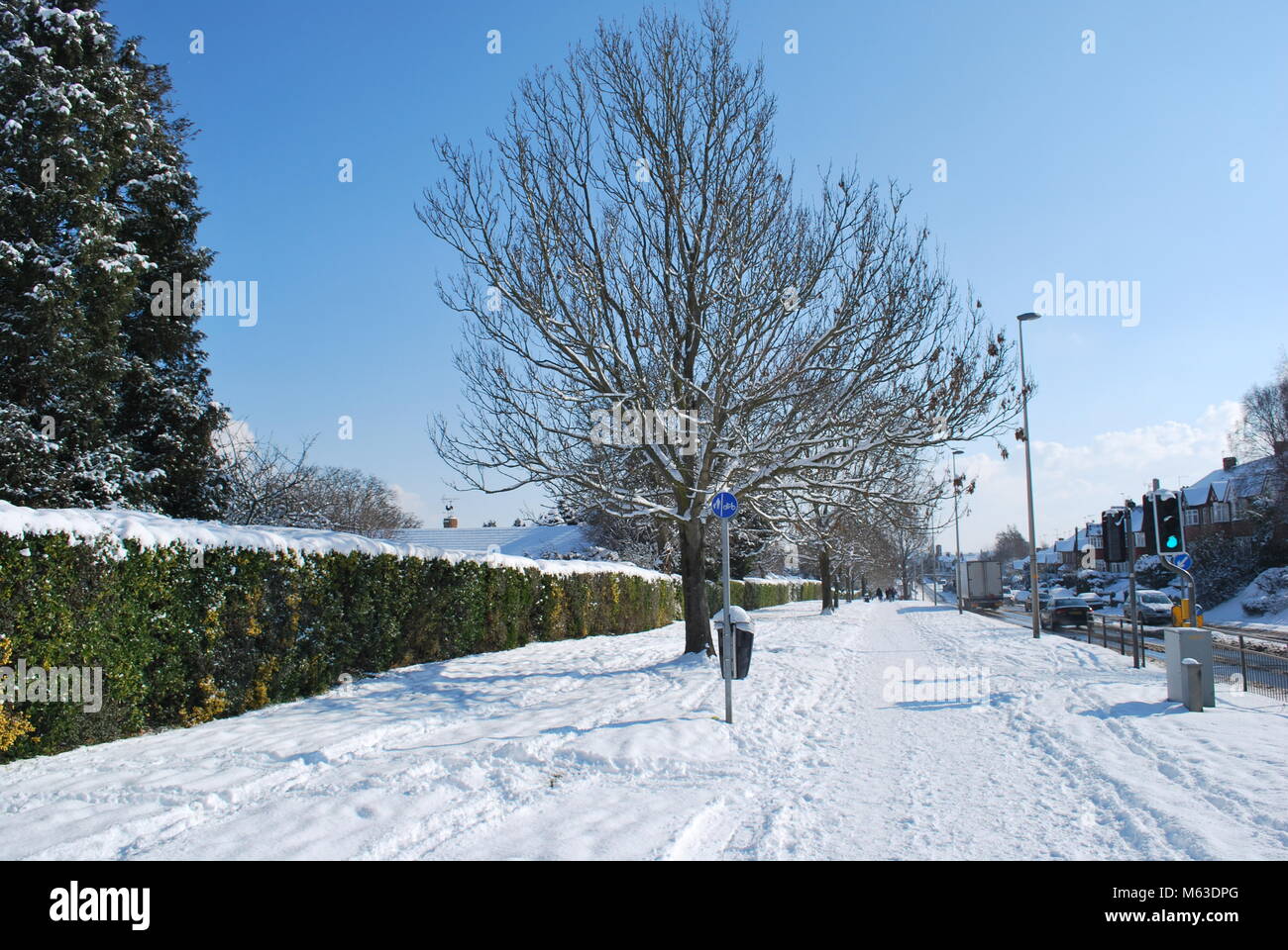 Snow covered road with pedestrian crossing hi-res stock photography and ...