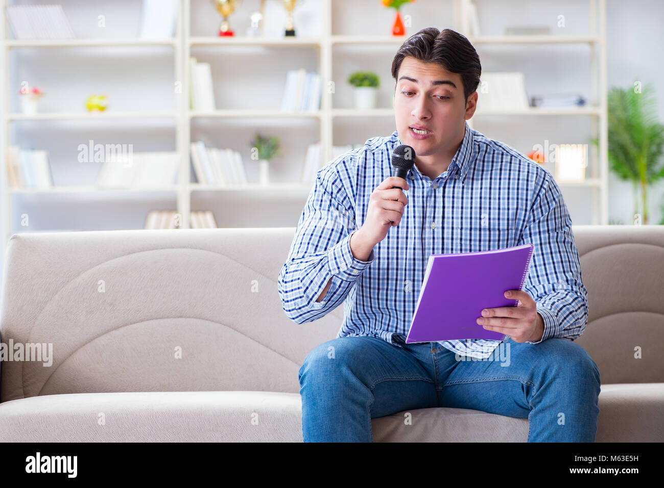 Funny man singing songs in karaoke at home Stock Photo - Alamy