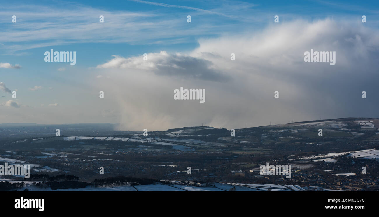 Snow storm moving across Manchester as seen from the moors above ...
