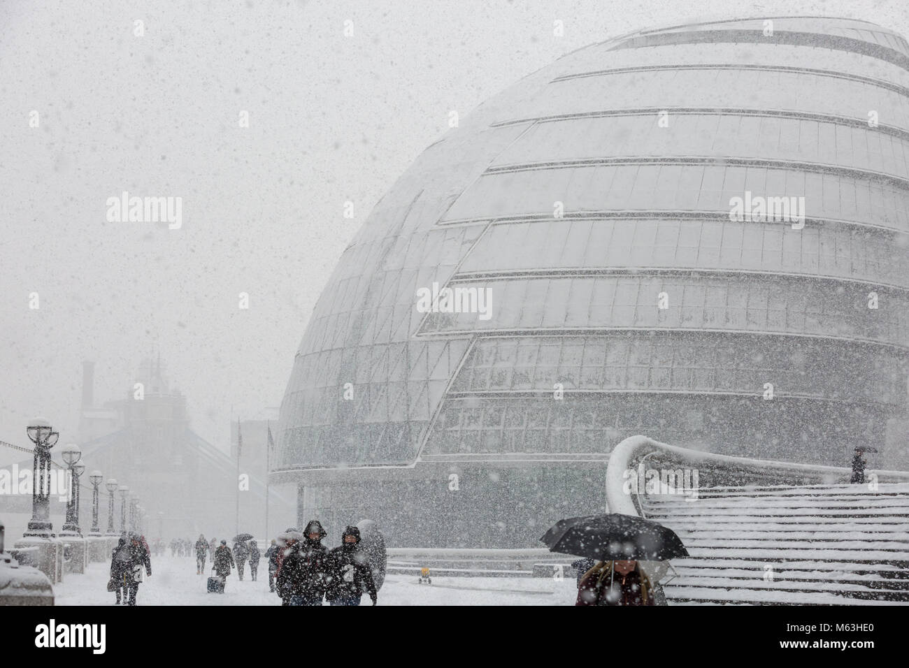 London, 28th Feb 2018. City Hall's windows are covered in snow and the ...