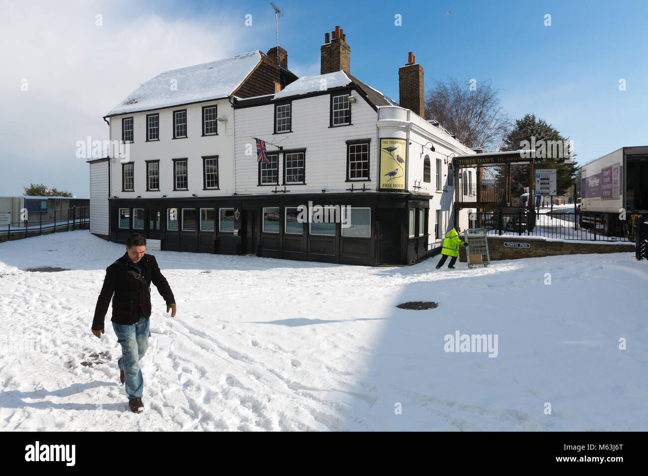 The historic smuggler's pub The Three Daws under snow by the River ...
