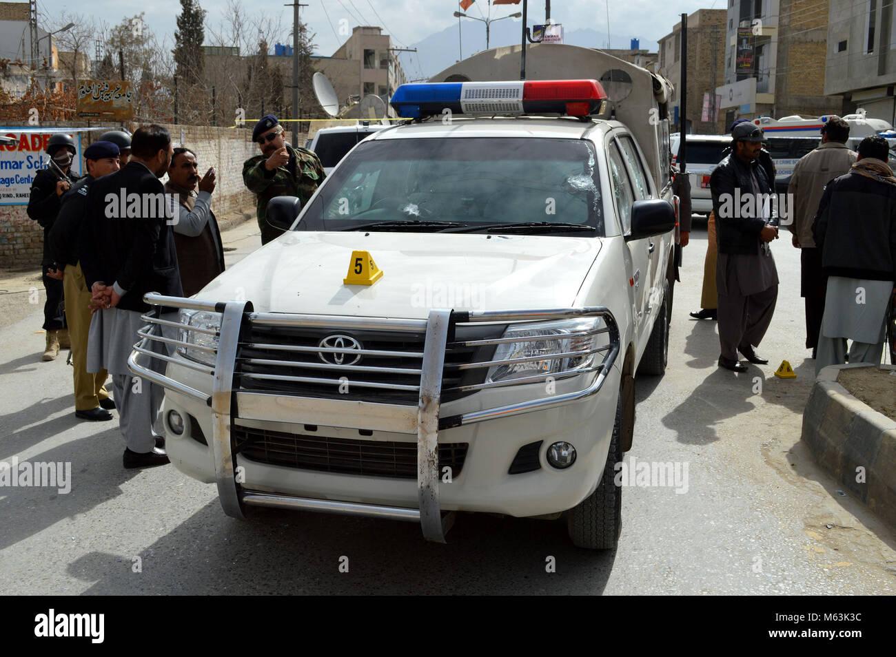 Quetta. 28th Feb, 2018. Pakistani policemen inspect a damaged police ...