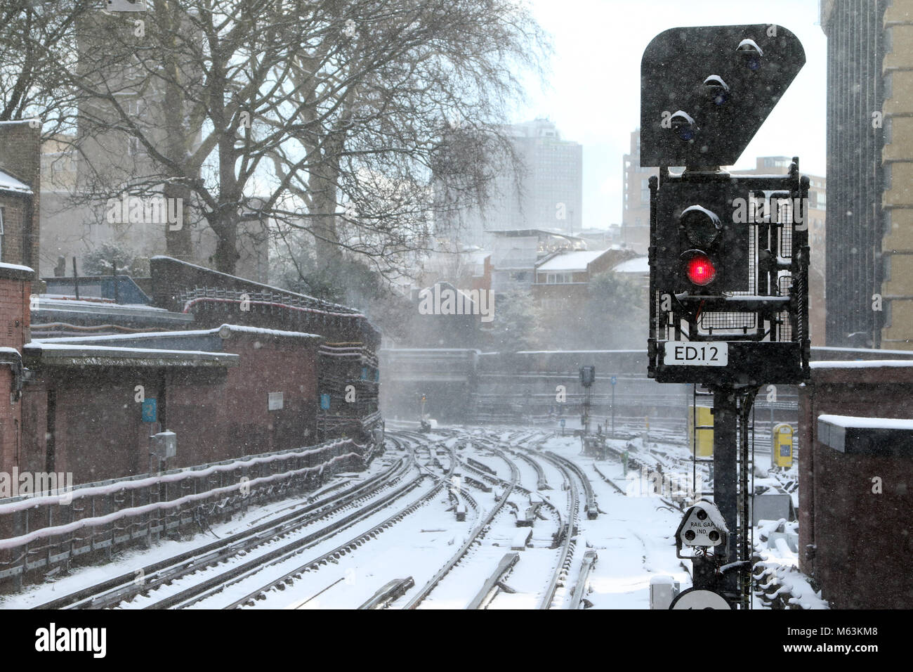 Red london bus in snow hi-res stock photography and images - Alamy