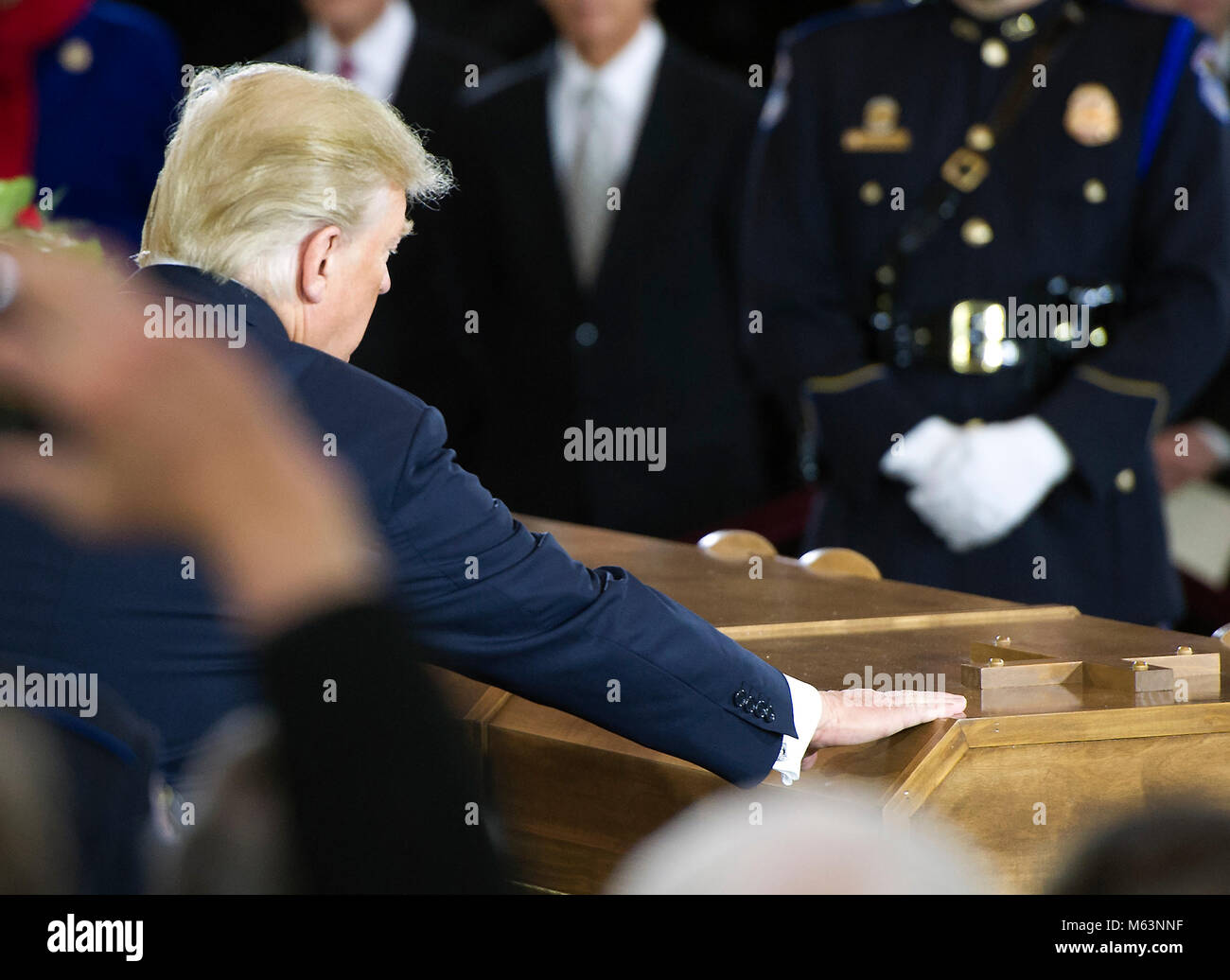 United States President Donald J. Trump touches the casket of the late ...