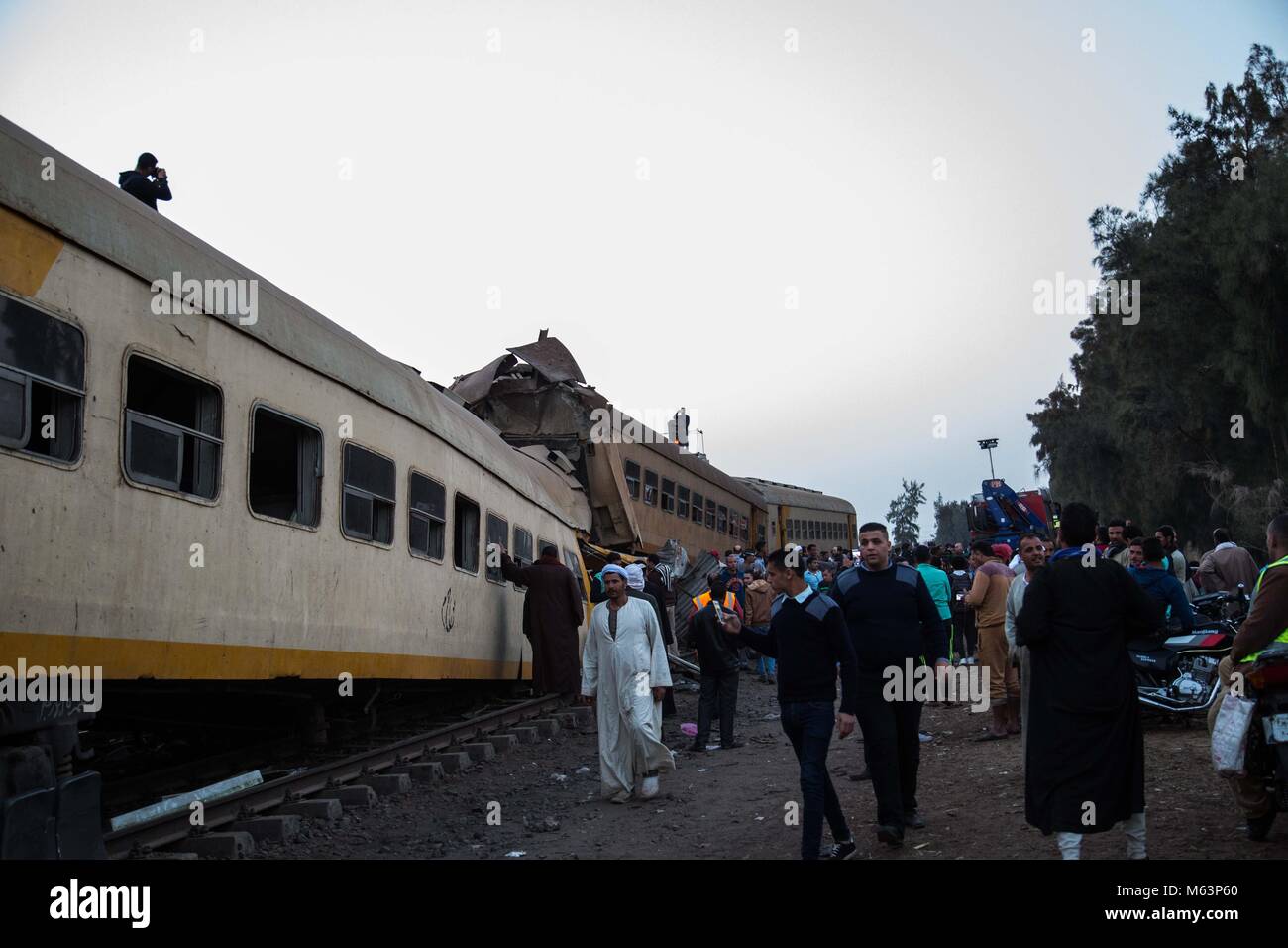 Kom Hamada, northern Egypt. 28th February, 2018. Egyptians stand at the ...