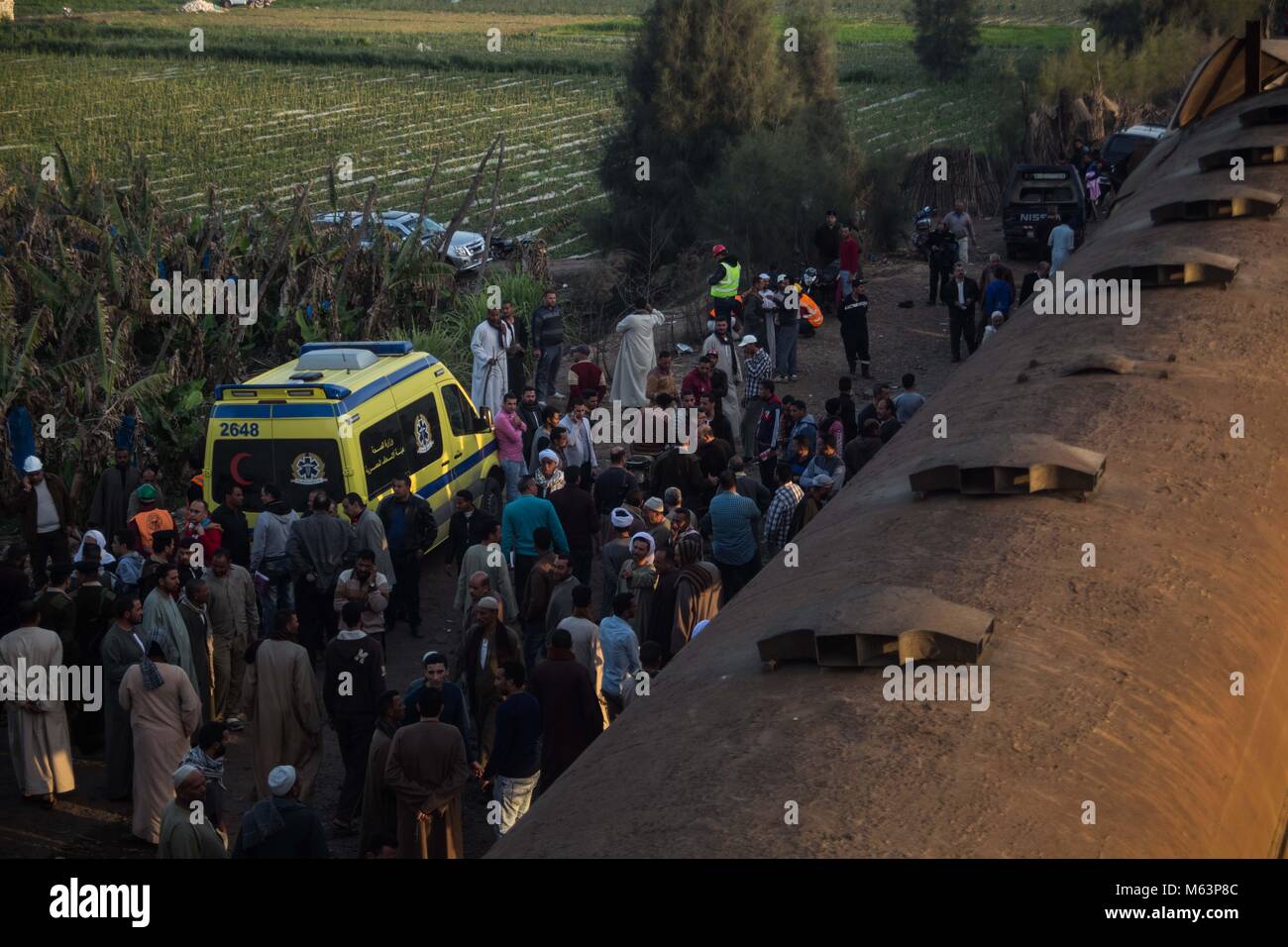 Kom Hamada, northern Egypt. 28th February, 2018. Egyptians stand at the ...