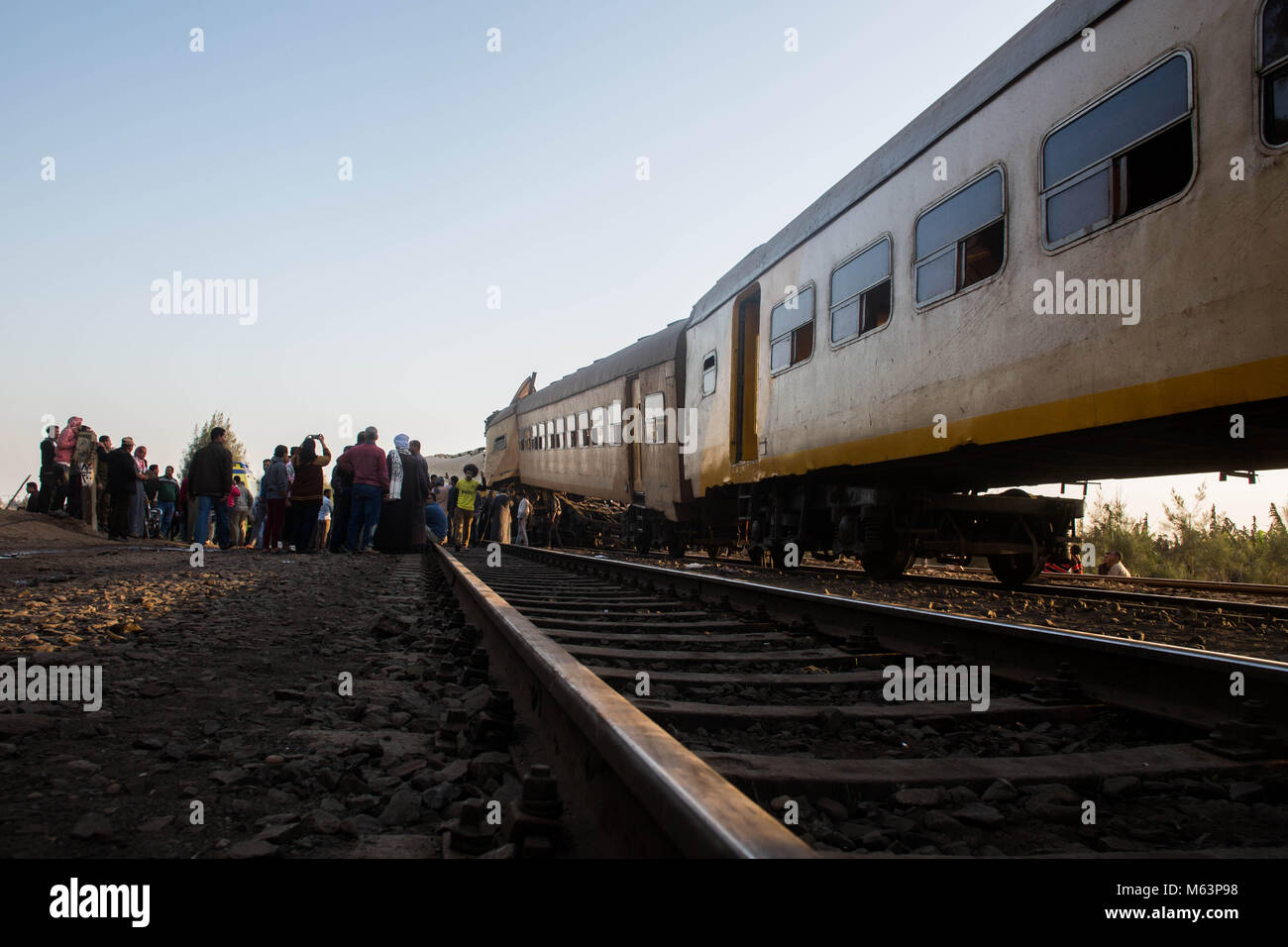 Kom Hamada, northern Egypt. 28th February, 2018. Egyptians stand at the ...