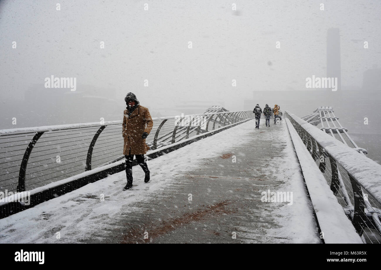 London, UK. 28th February, 2018. London's blizzard on Millennium bridge ...