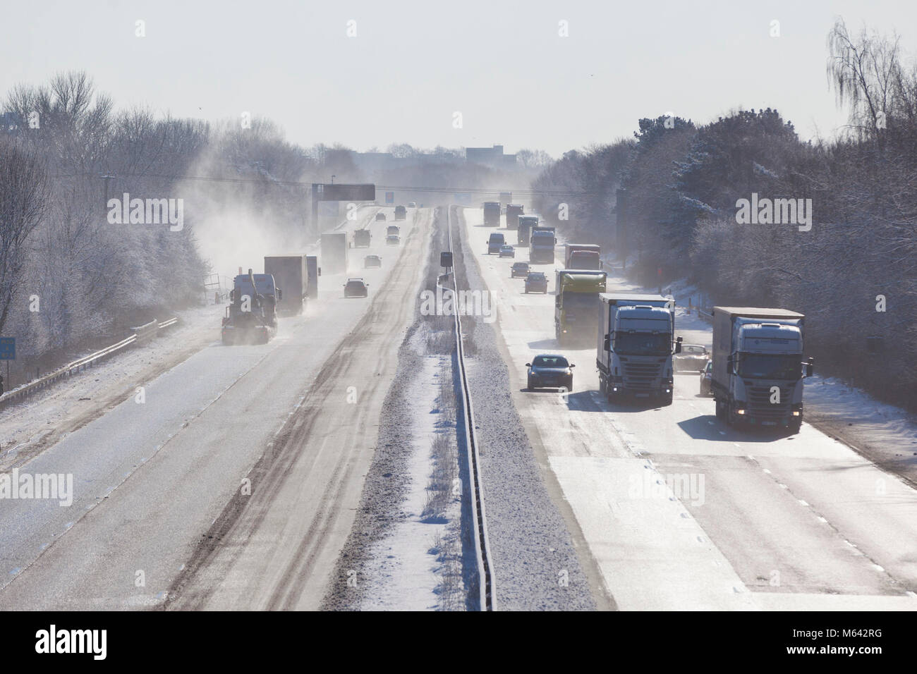 Beast from the East. Lorries and cars driving in snow, Ashford, Kent ...