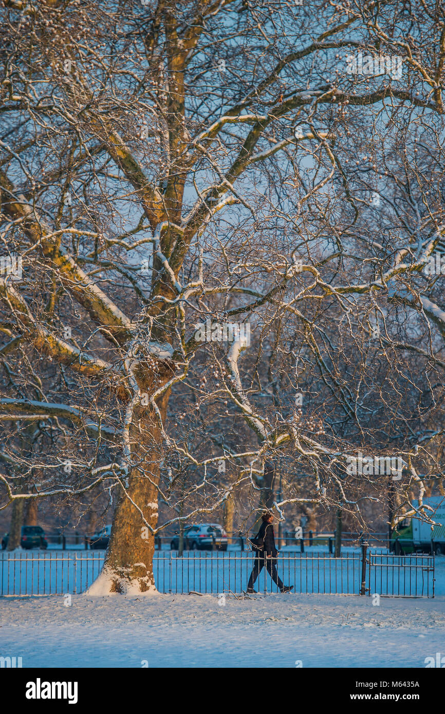 London, UK. 28th Feb, 2018. UK Weather: Families and commuters cross ...