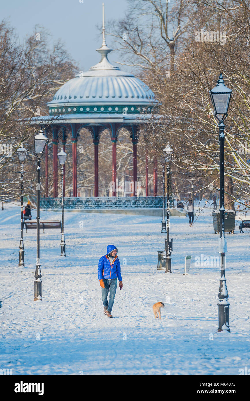 London, UK. 28th Feb, 2018. UK Weather: Families and commuters cross ...