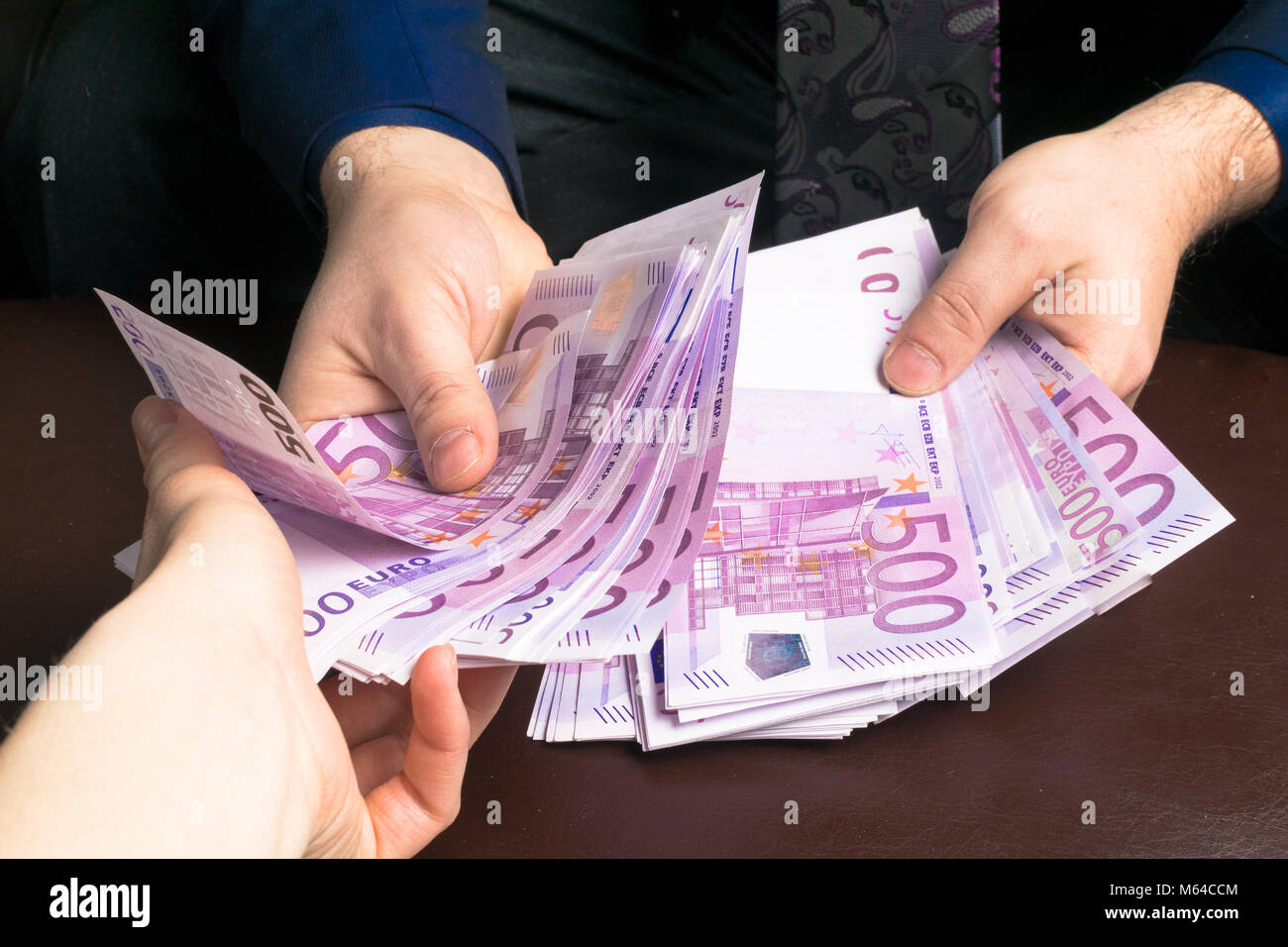 Man in Men's Suits.Bribe and corruption with euro banknotes Stock Photo ...