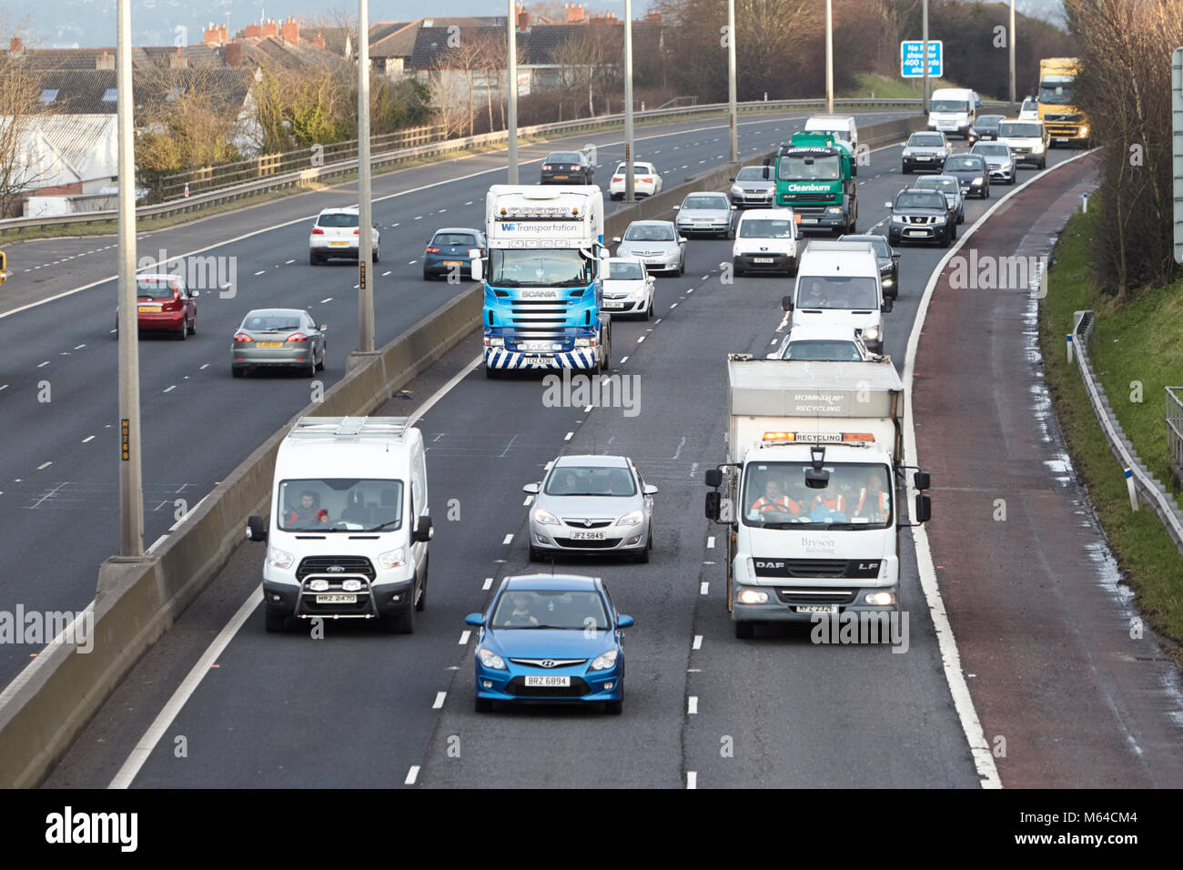 cars driving along the M2 motorway outside Belfast at rush hour ...