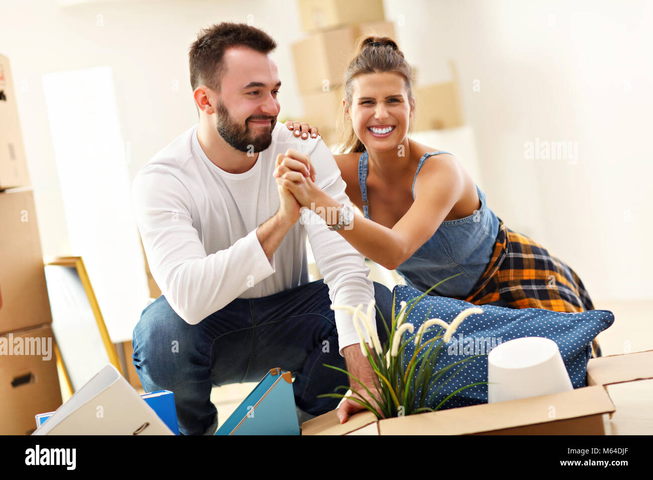 Happy adult couple moving out or in to new home Stock Photo - Alamy