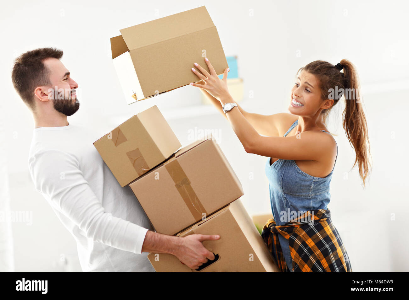 Happy adult couple moving out or in to new home Stock Photo - Alamy