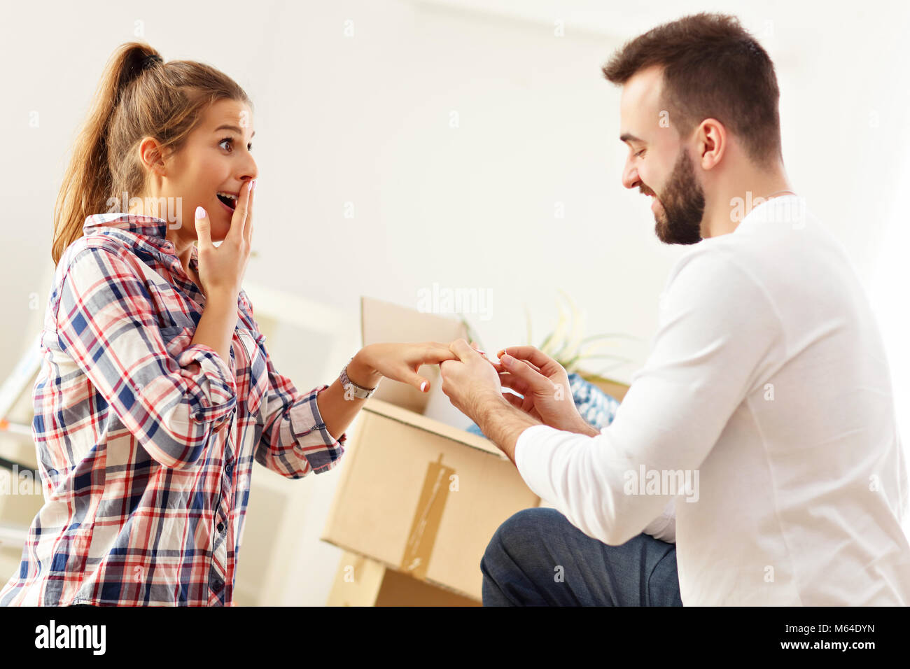 Happy adult couple moving out or in to new home Stock Photo - Alamy