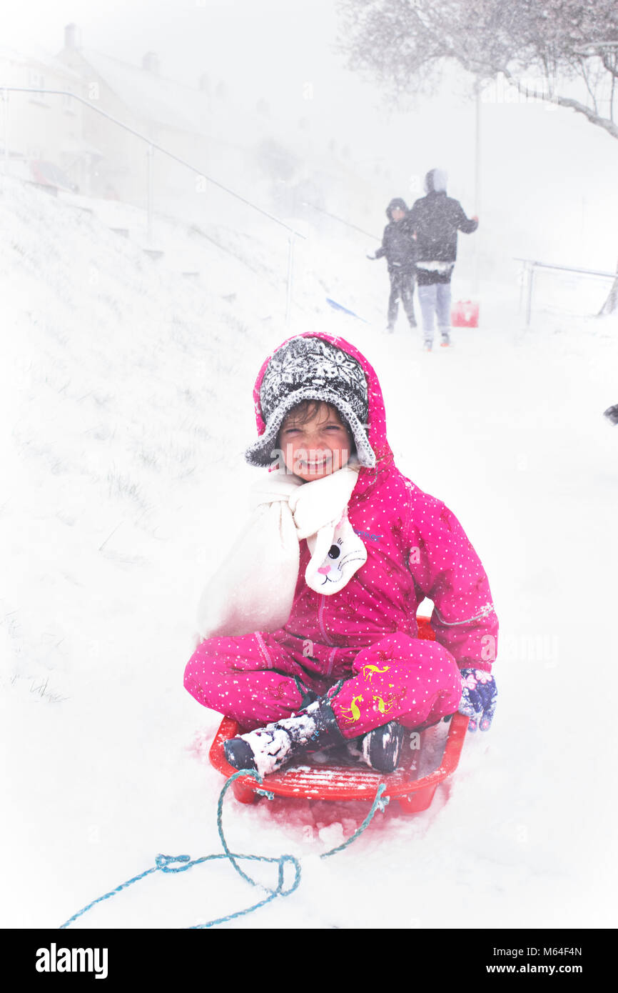 Little girl having fun in the snowfall of 2018 in Cornwall United ...
