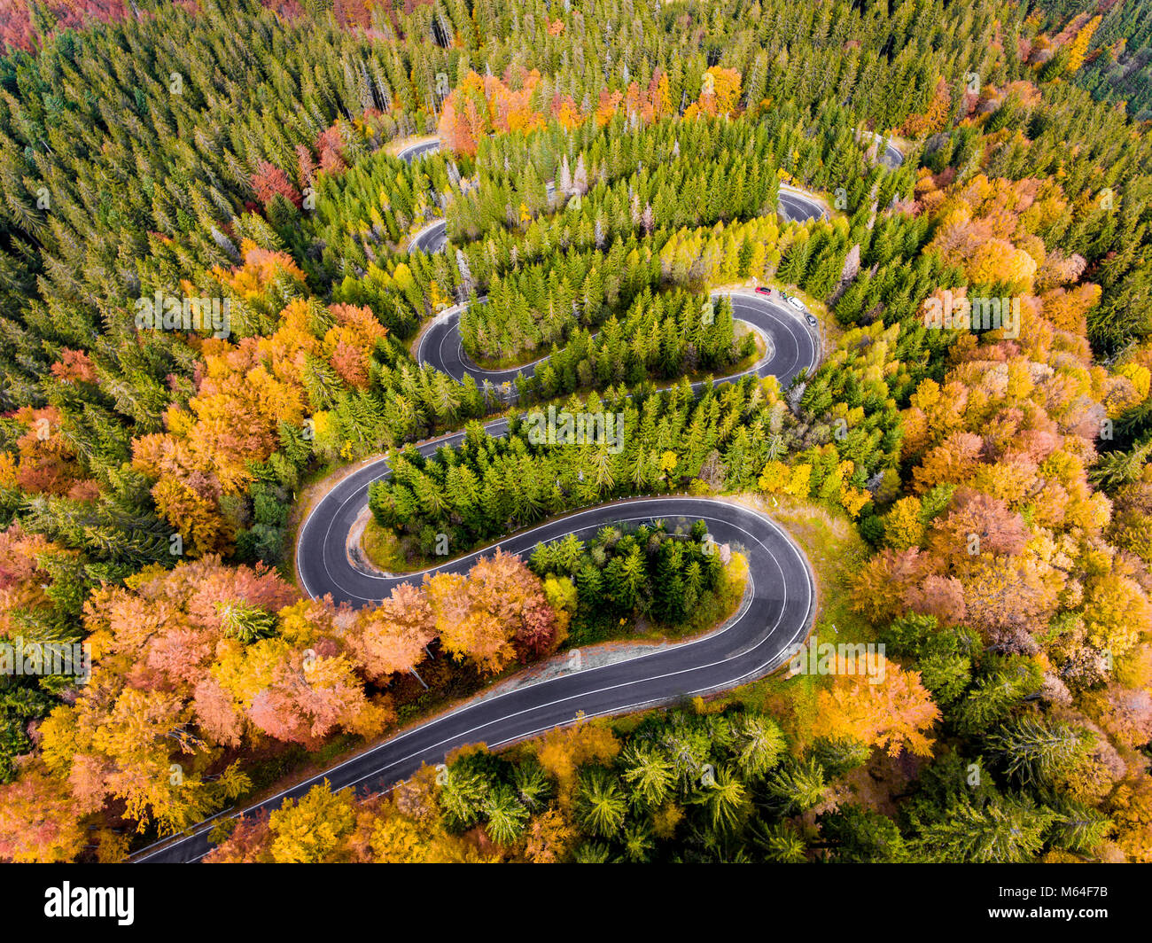 Winding Road in the Mountains in the middle of the Autumn Stock Photo ...
