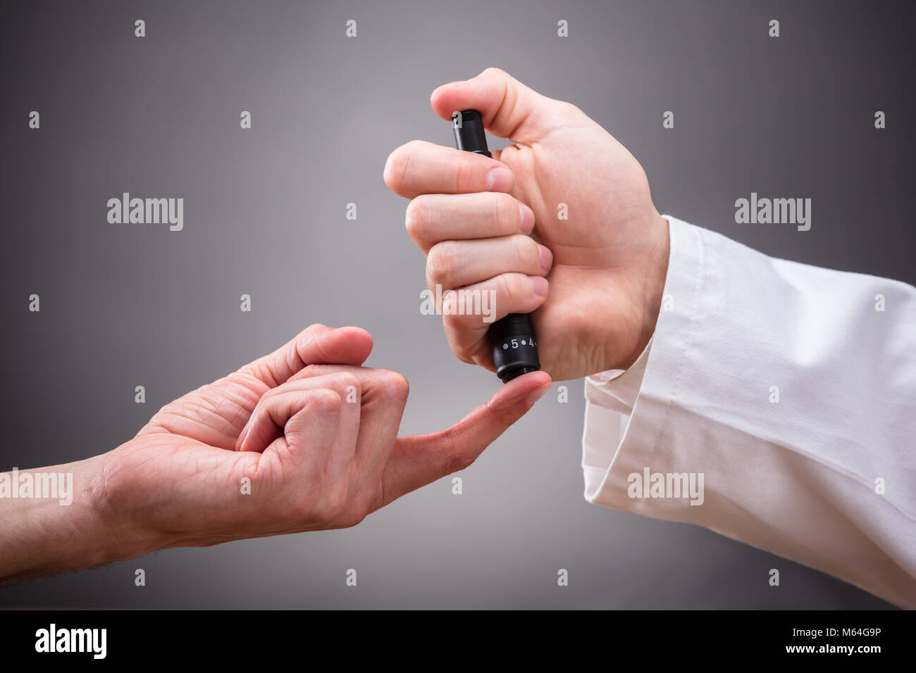 Close-up Of Doctor's Hand Checking Patient's Sugar Level With ...