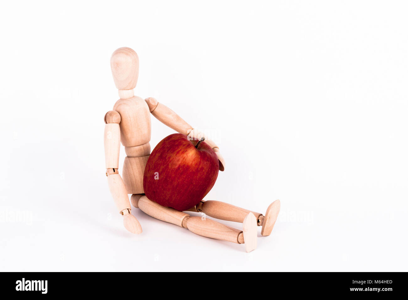 Puppet with red apple Stock Photo - Alamy