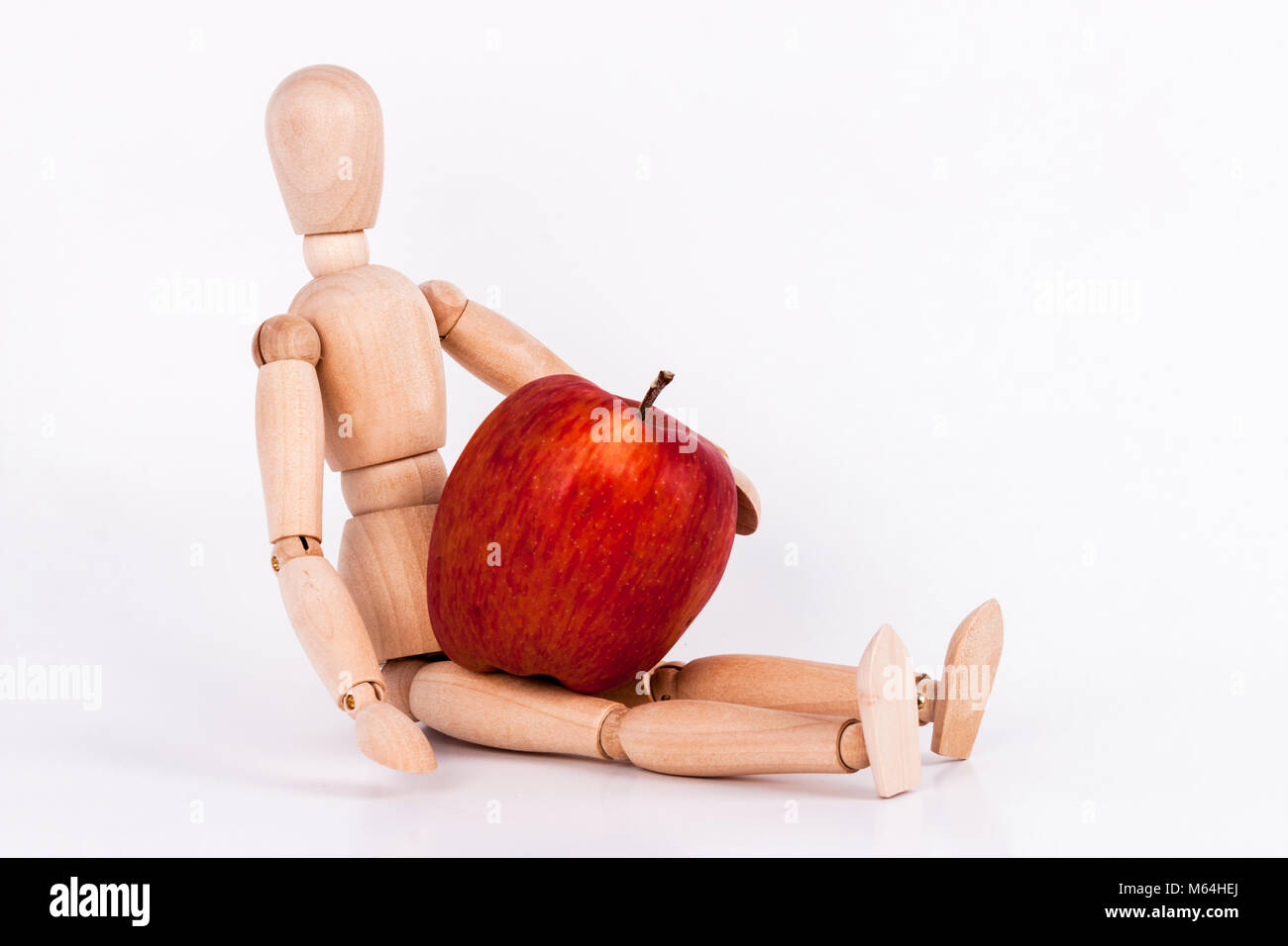 Puppet with red apple Stock Photo - Alamy