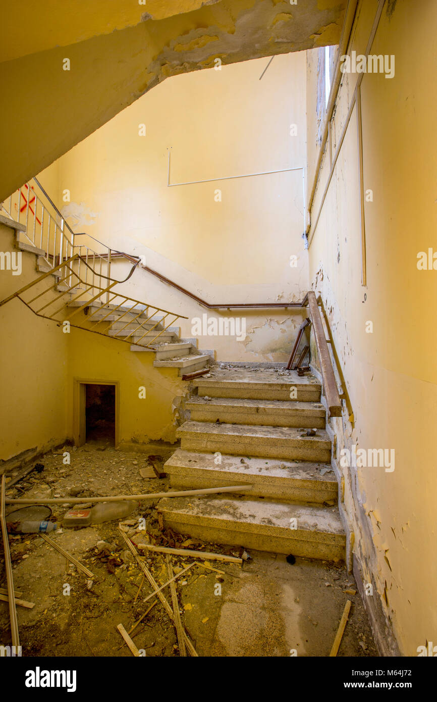 Derelict hotel staircase Stock Photo - Alamy