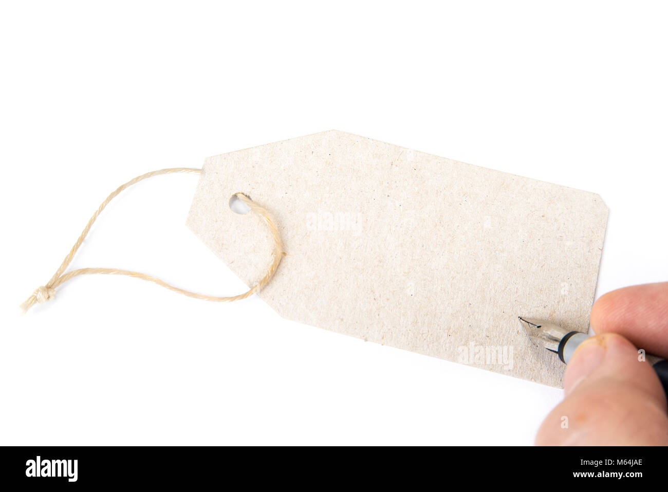 Blank paper label or cloth tag on the white Stock Photo - Alamy