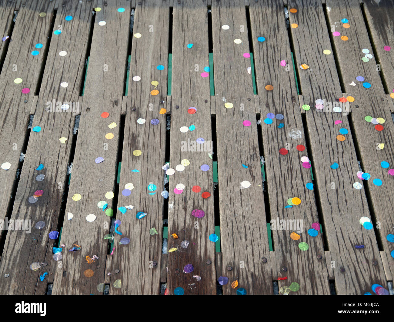 Confetti on the decking of Brighton pier Stock Photo - Alamy