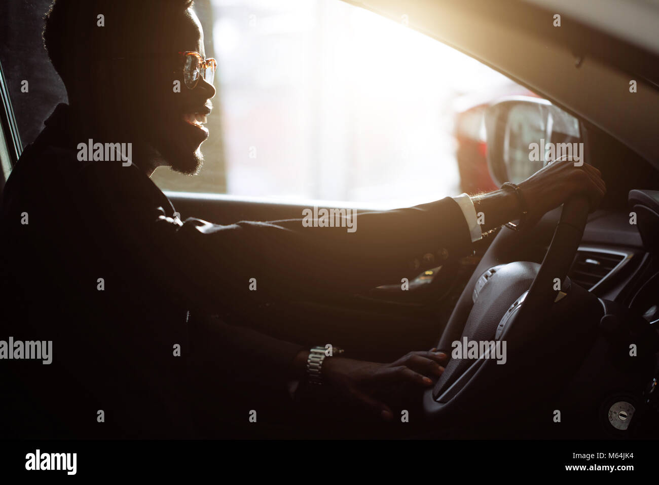 Stylish black man in car Stock Photo - Alamy