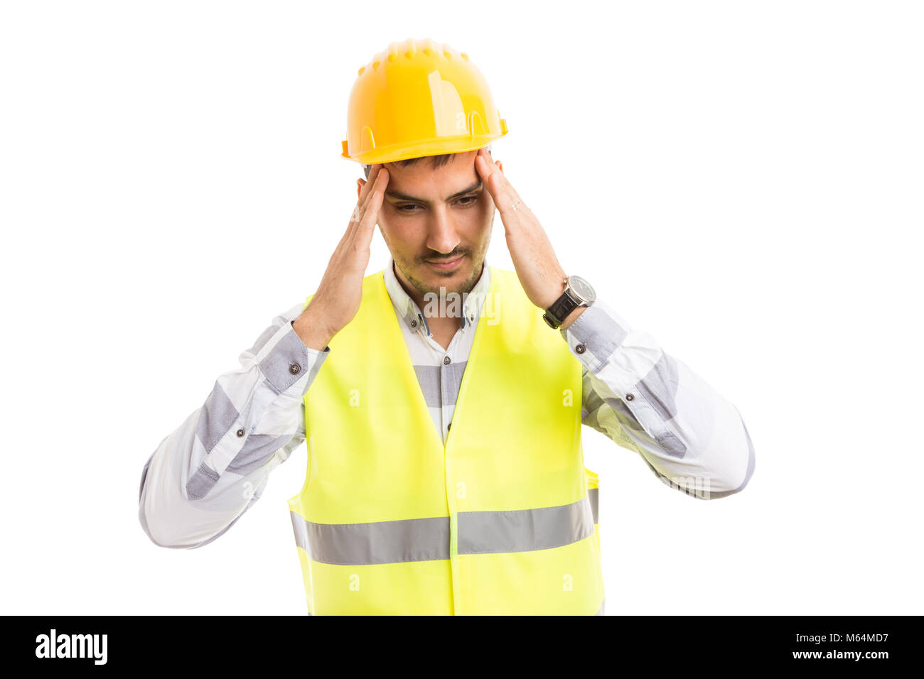 Stressed architect or engineer massaging temples as migraine and ...